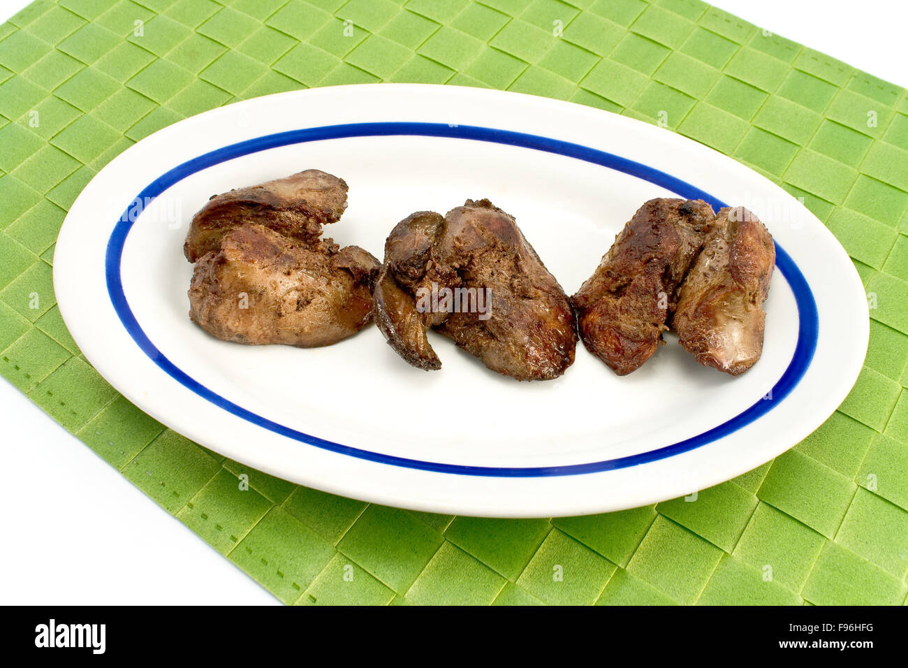 Three chicken fried livers in plate Stock Photo - Alamy