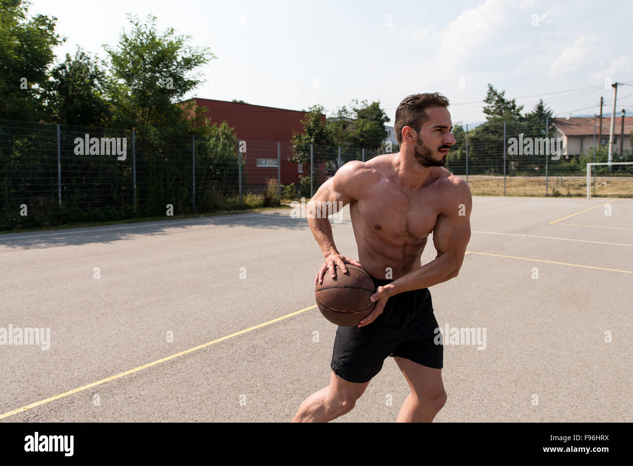 Basketball Player Bodybuilder Practicing And Posing For Basketball And ...