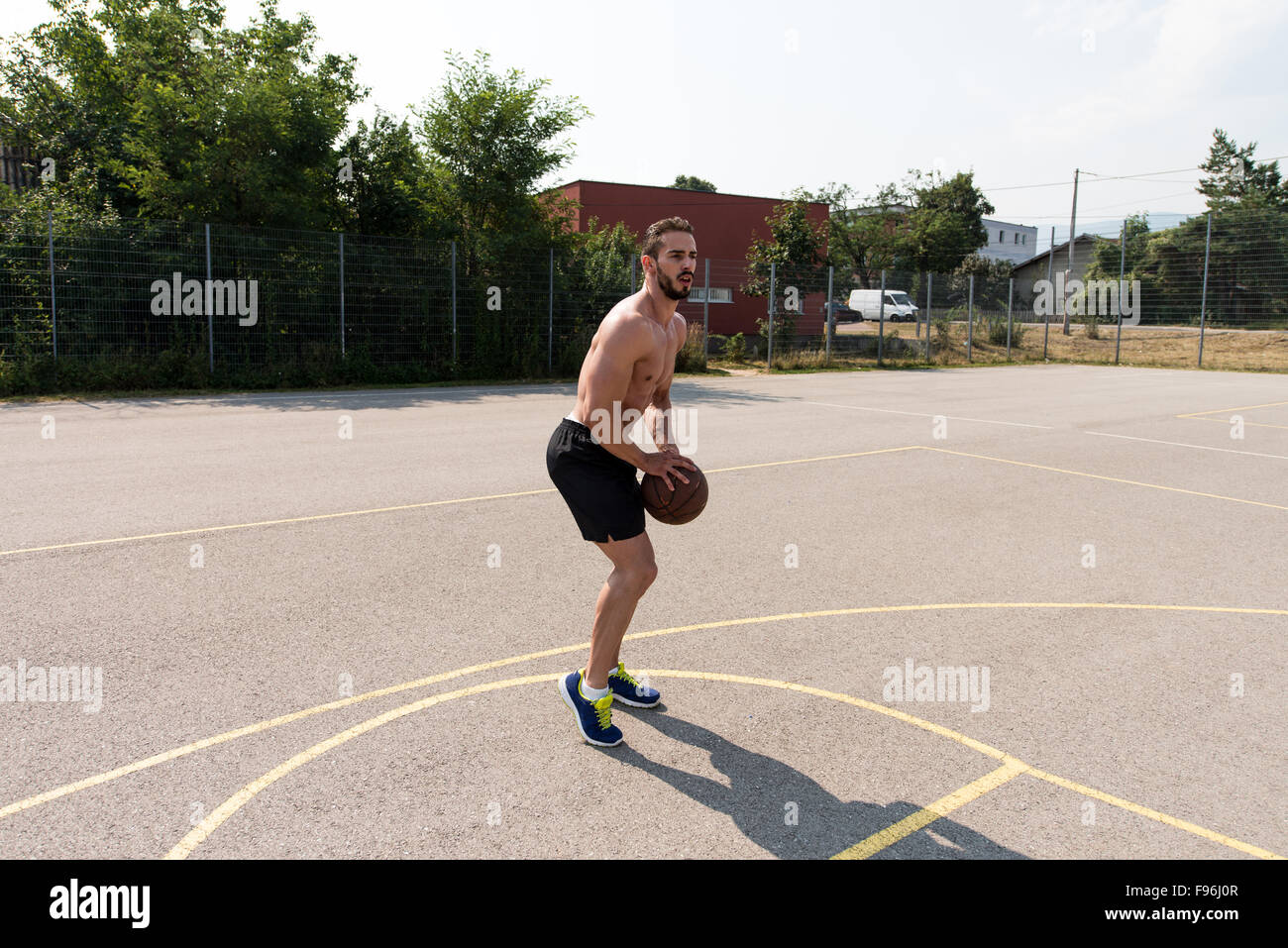 Basketball Player Bodybuilder Practicing And Posing For Basketball And ...