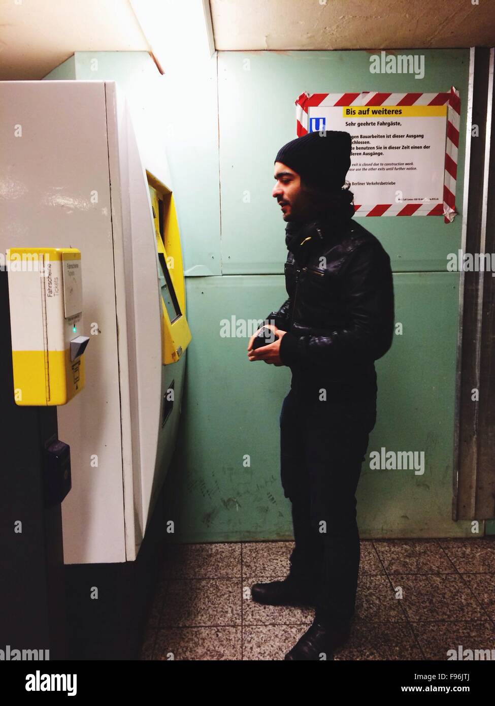 Young man cash machine hi-res stock photography and images - Alamy