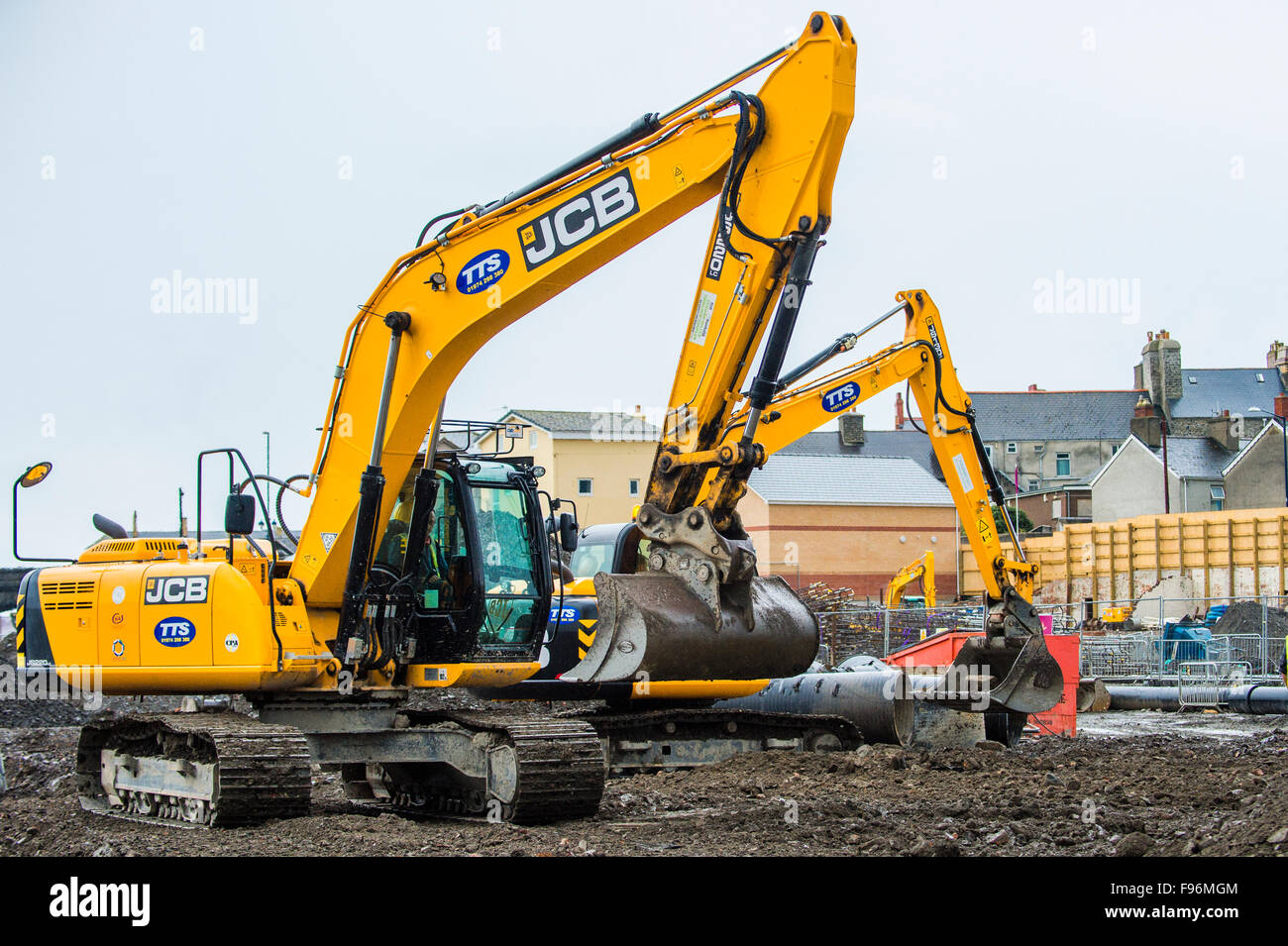Yellow JCB JS220 and JS130 caterpillar track digger excavators operated ...
