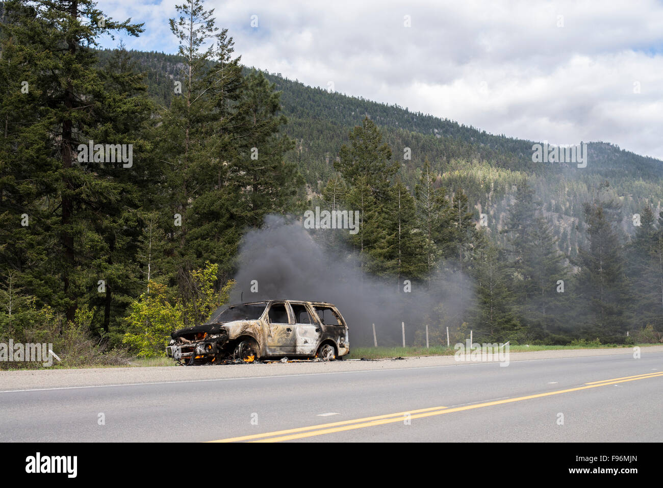 Car on fire on the side of highway Stock Photo - Alamy