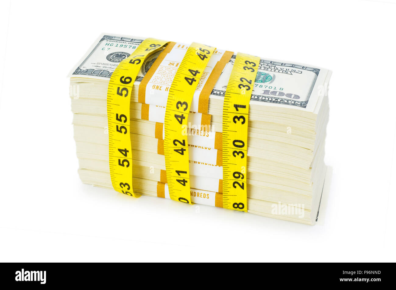 Financial concept - measuring money isolated on white Stock Photo - Alamy