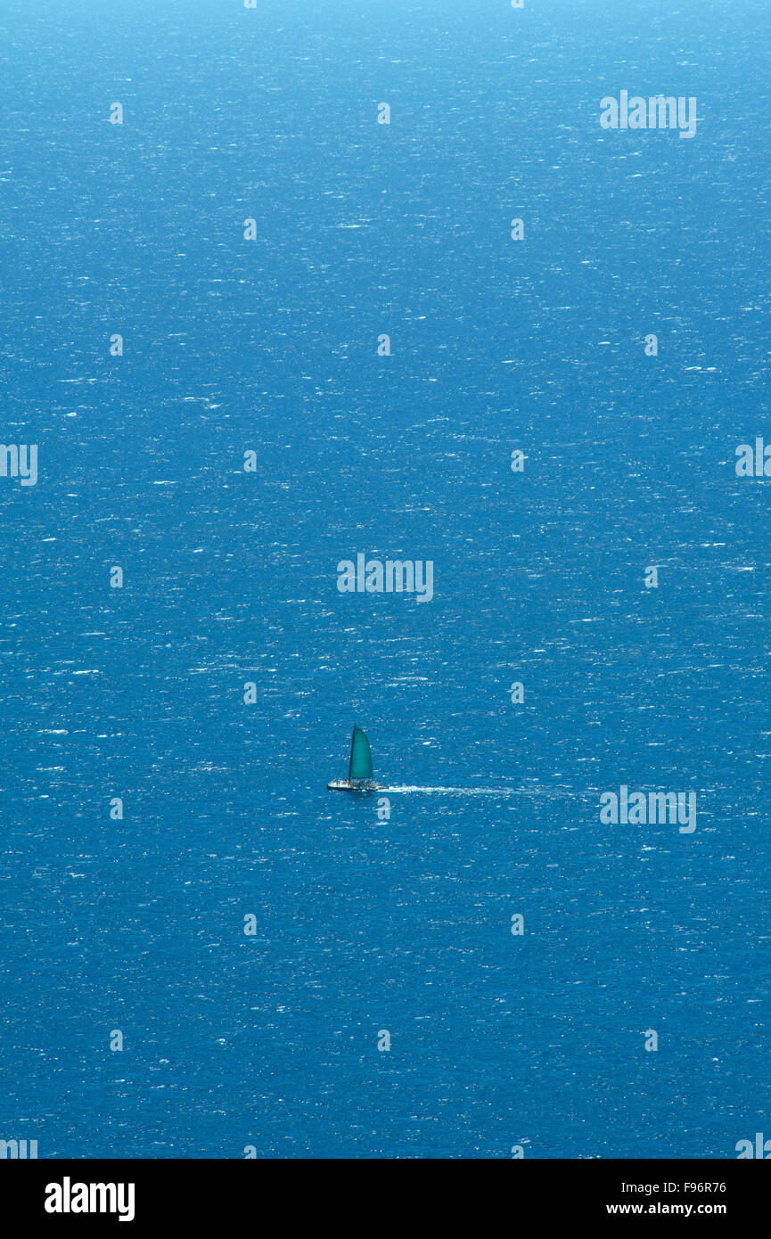Small yacht sailing in open ocean Stock Photo - Alamy