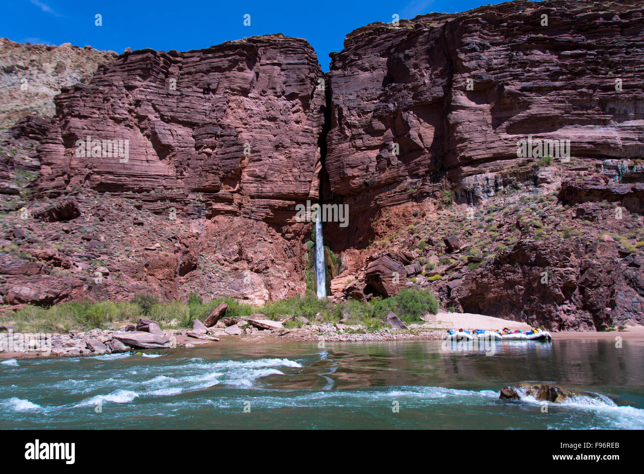 Waterfall and expedition rafts, Colorado River, Grand Canyon, Arizona ...