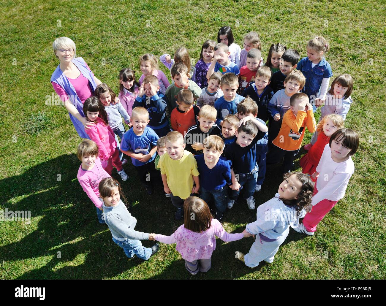 happy child kids group have fun and play at kindergarden outdoor ...