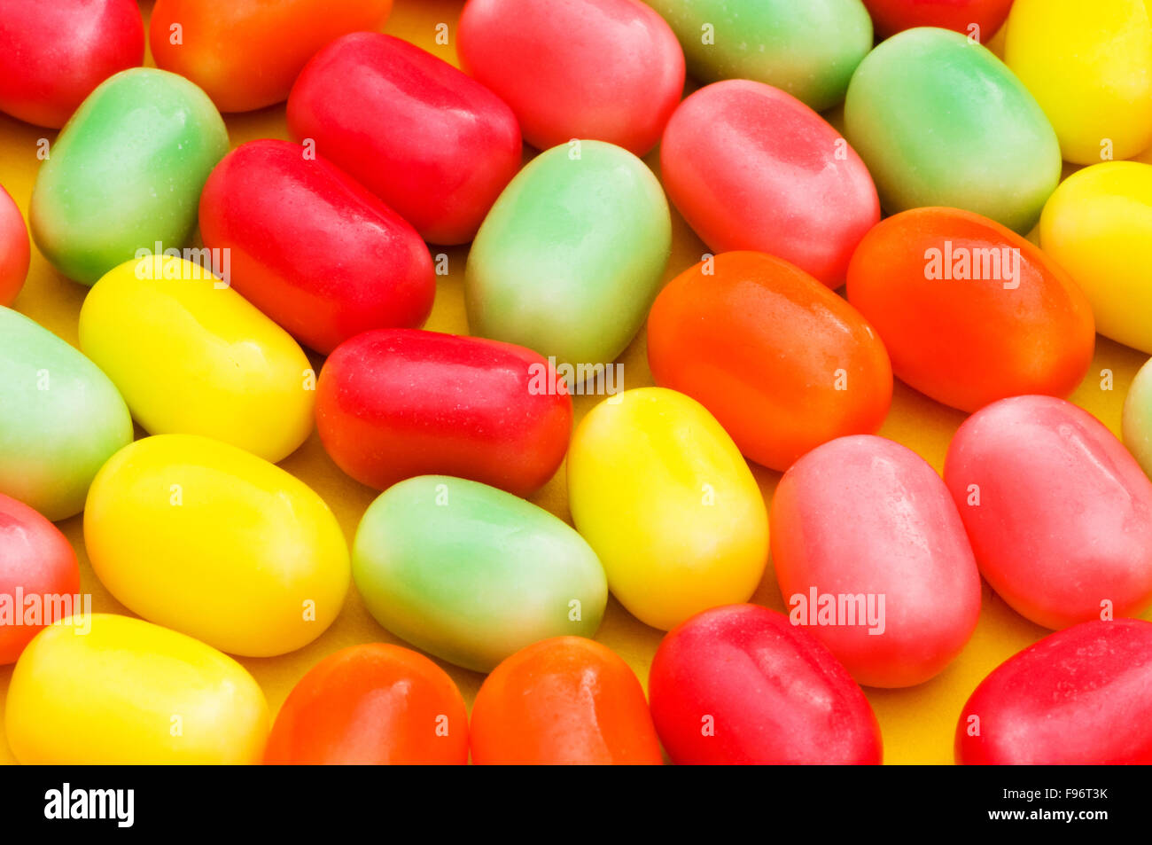 Various dry colourful sweets arranged as background Stock Photo - Alamy