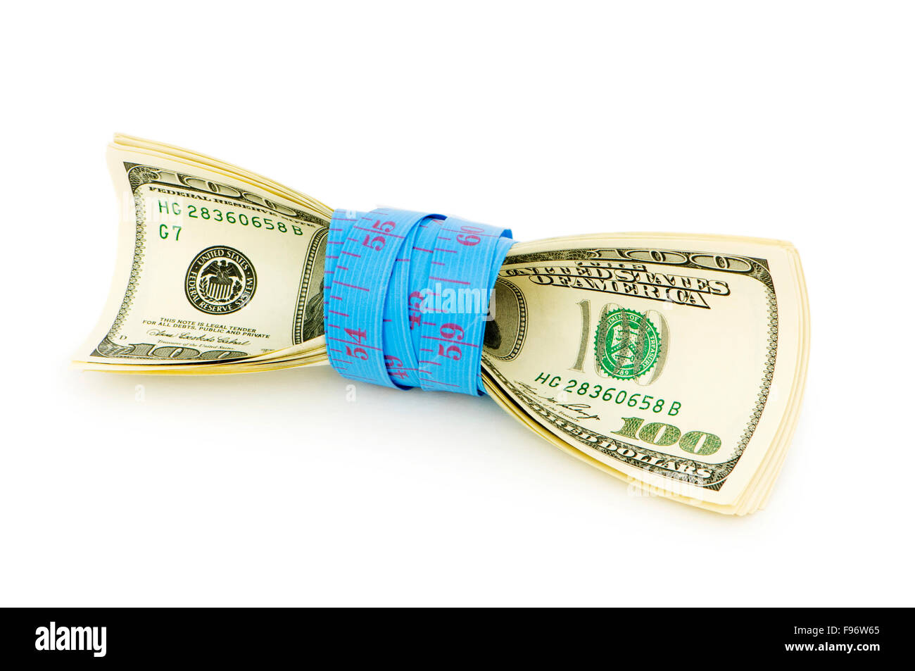 Financial concept - measuring money on white Stock Photo - Alamy