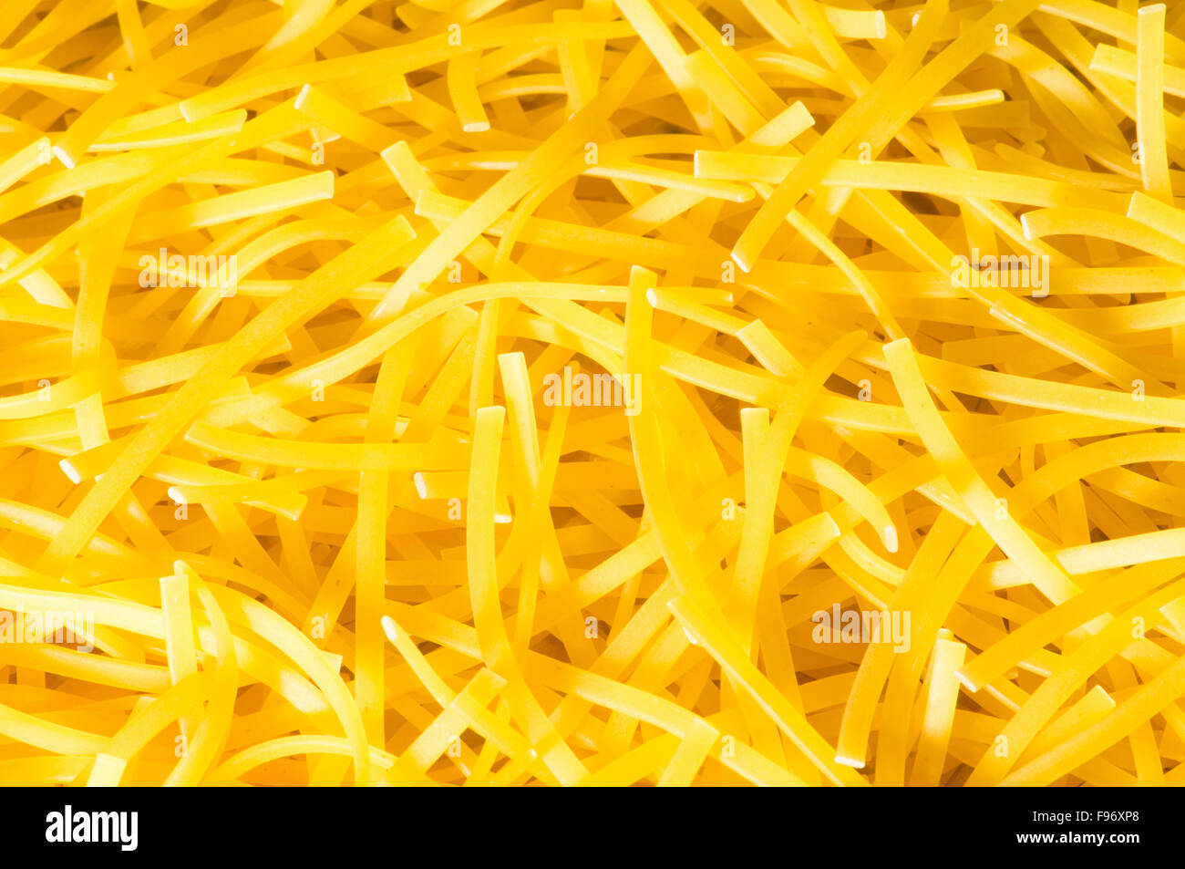 Extreme close up of yellow italian pasta Stock Photo - Alamy