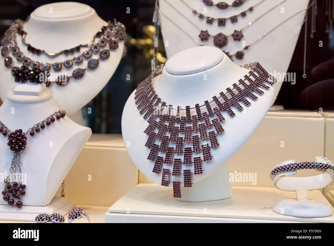 counter with garnet jewelry in store window Stock Photo - Alamy