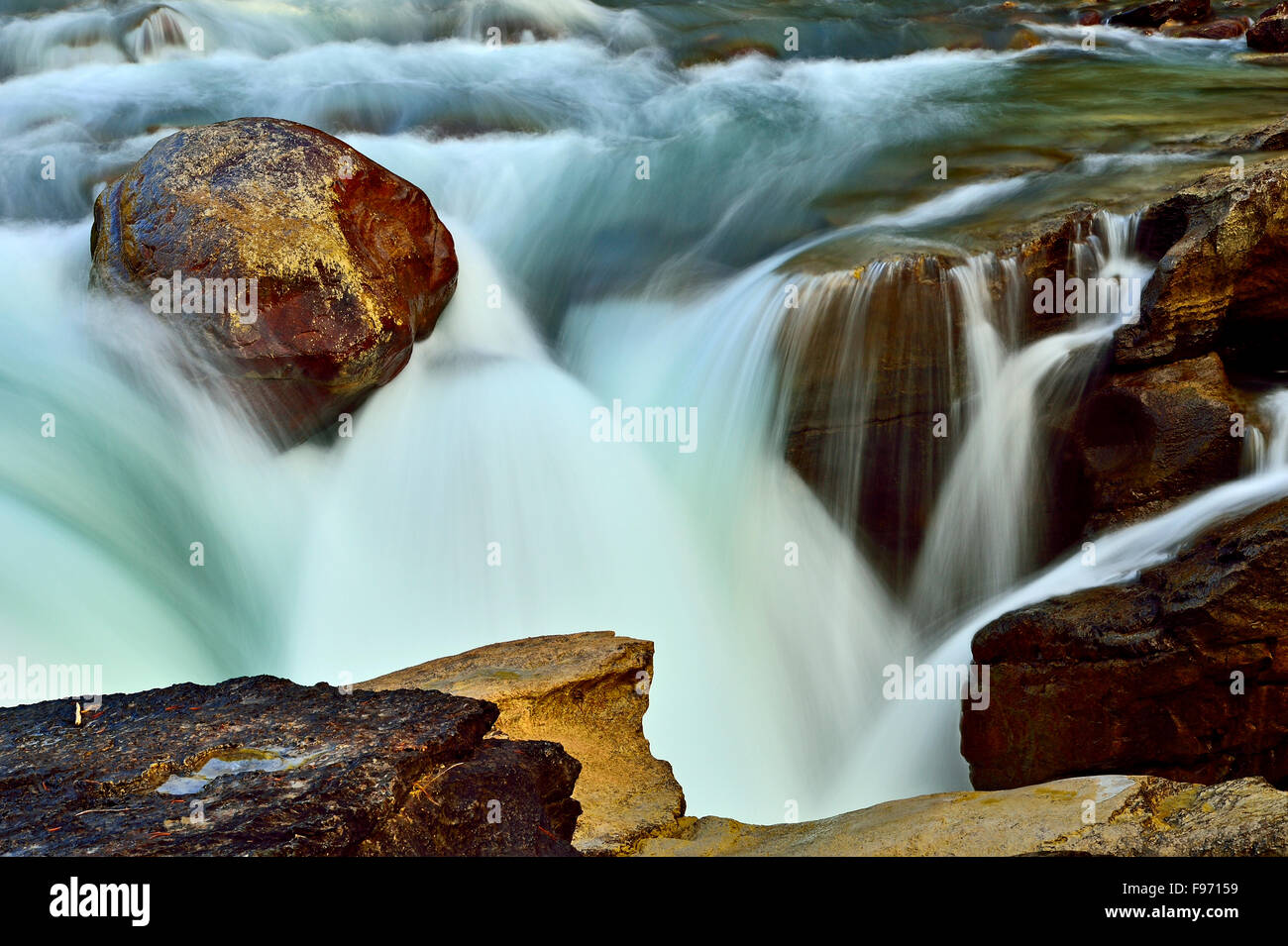 A horizontal landscape image of a big rock on the top of the Sunwapta ...