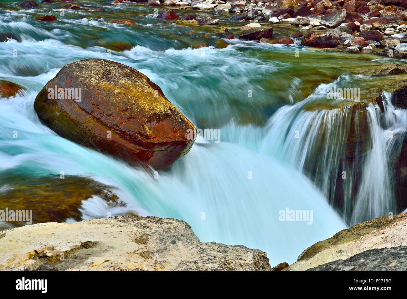 A horizontal landscape image of a big rock on the top of the Sunwapta ...