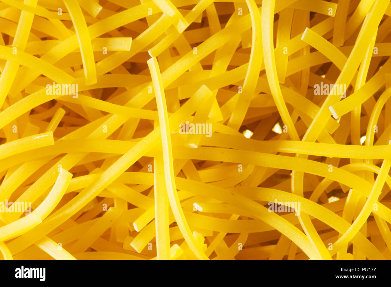 Extreme close up of yellow italian pasta Stock Photo - Alamy