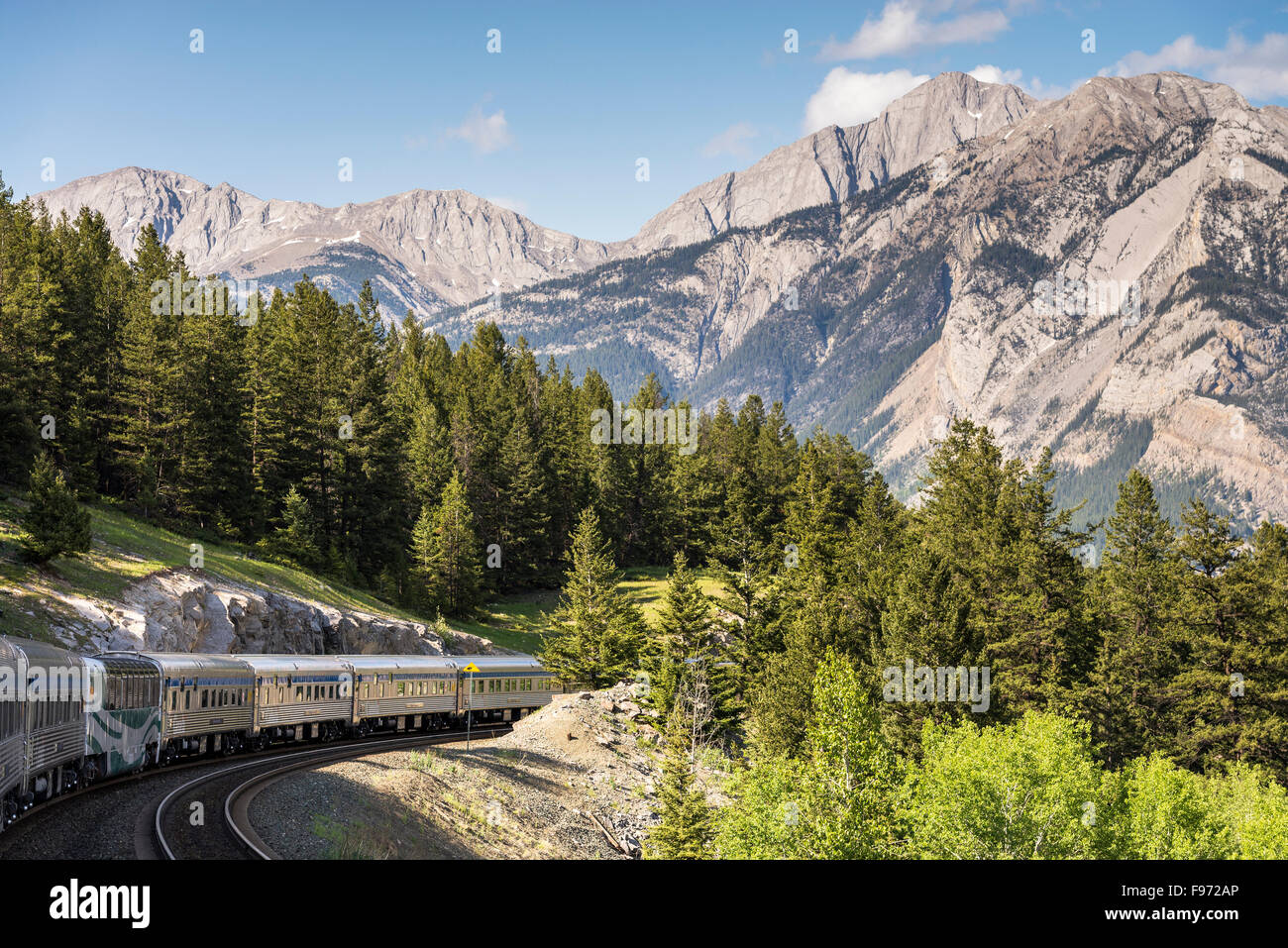 Passenger train going through the Rocky Mountains in Jasper National ...