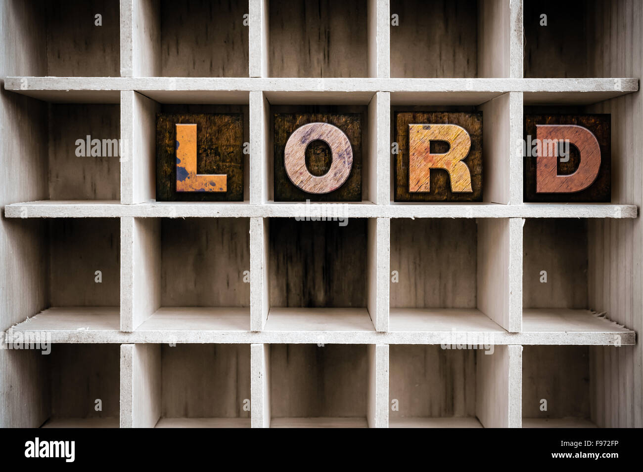 The word "LORD" written in vintage ink stained wooden letterpress type ...