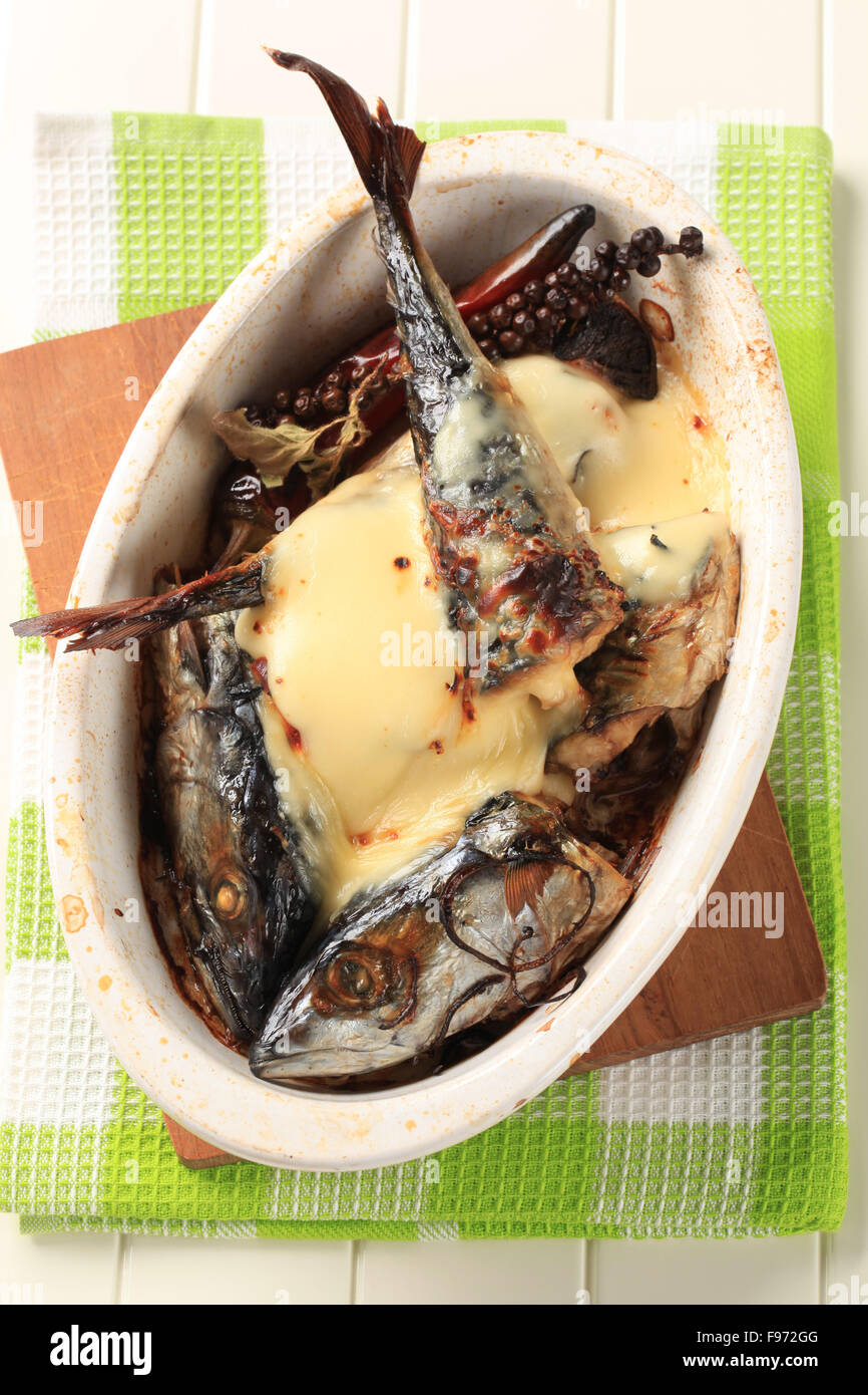 Pieces of oven baked mackerel with cream sauce Stock Photo - Alamy
