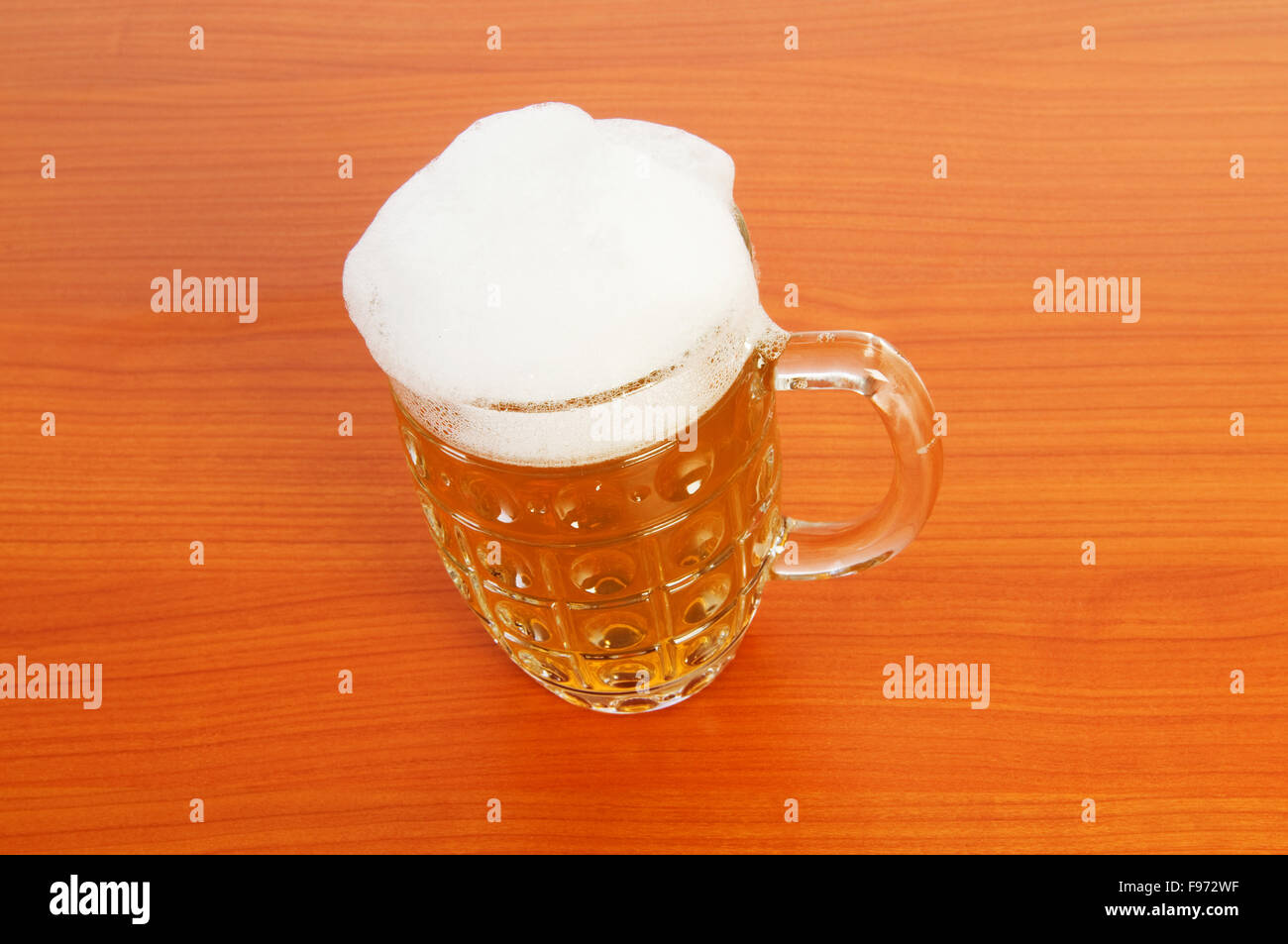 Beer glass on the wooden table Stock Photo - Alamy