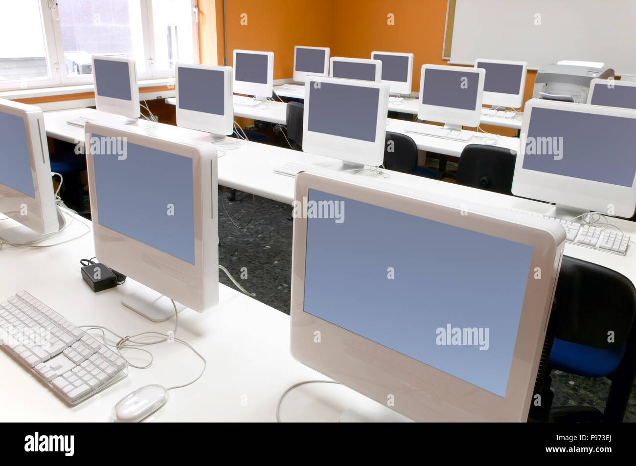 Multimedia classroom with large group of computers Stock Photo - Alamy