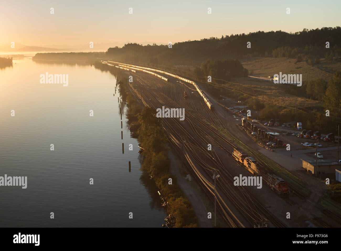 Overview of CN (Canadian National) rail yards and the Fraser River in Surrey, British Columbia ...