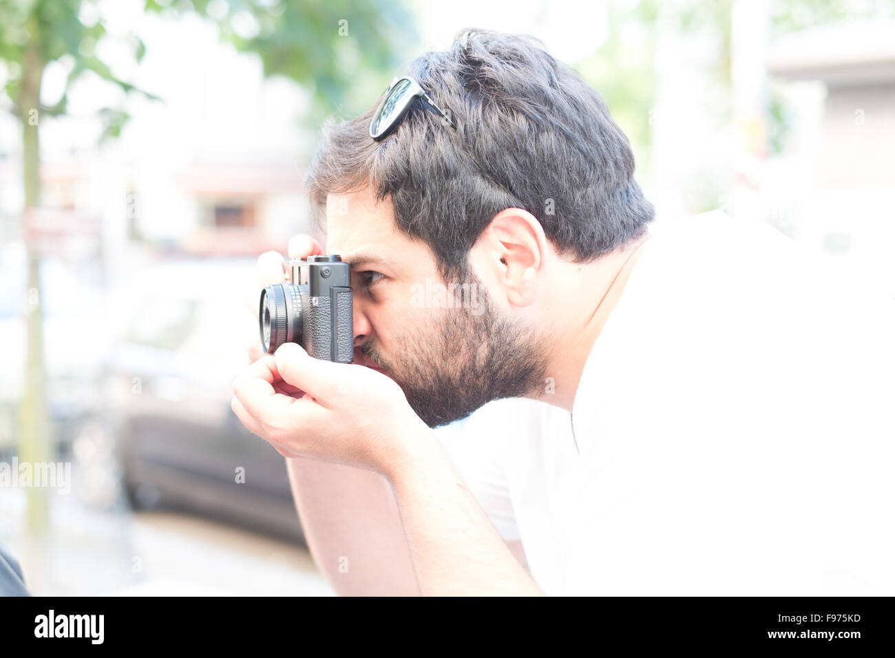 Side View Of Young Man Photographing Through Digital Camera Stock Photo ...