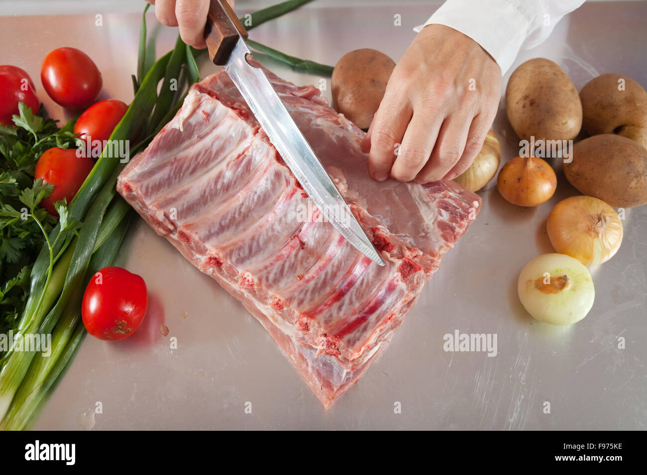 Cook hands with raw meat in kitchen Stock Photo - Alamy