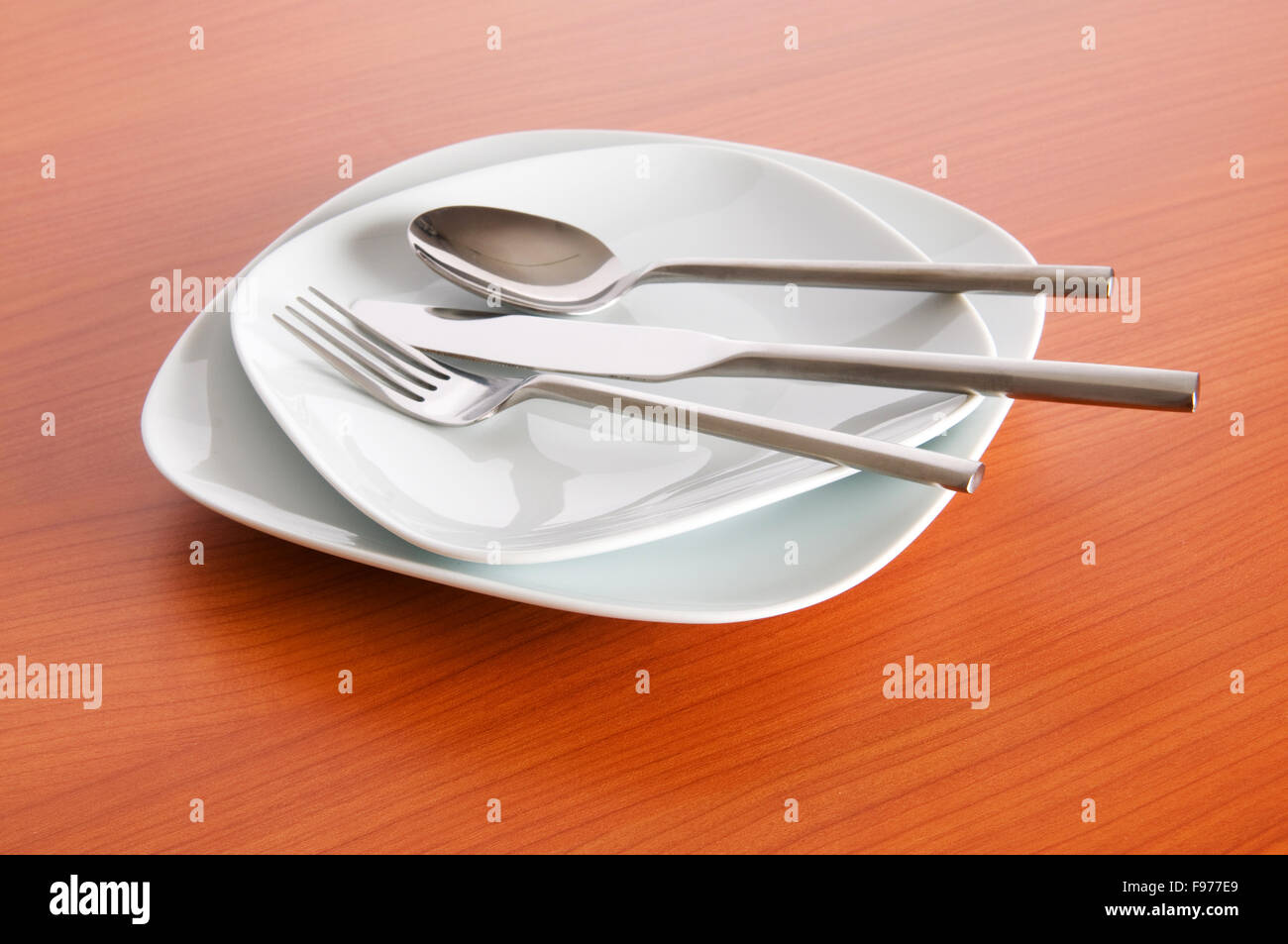 Set of utensils arranged on the table Stock Photo - Alamy