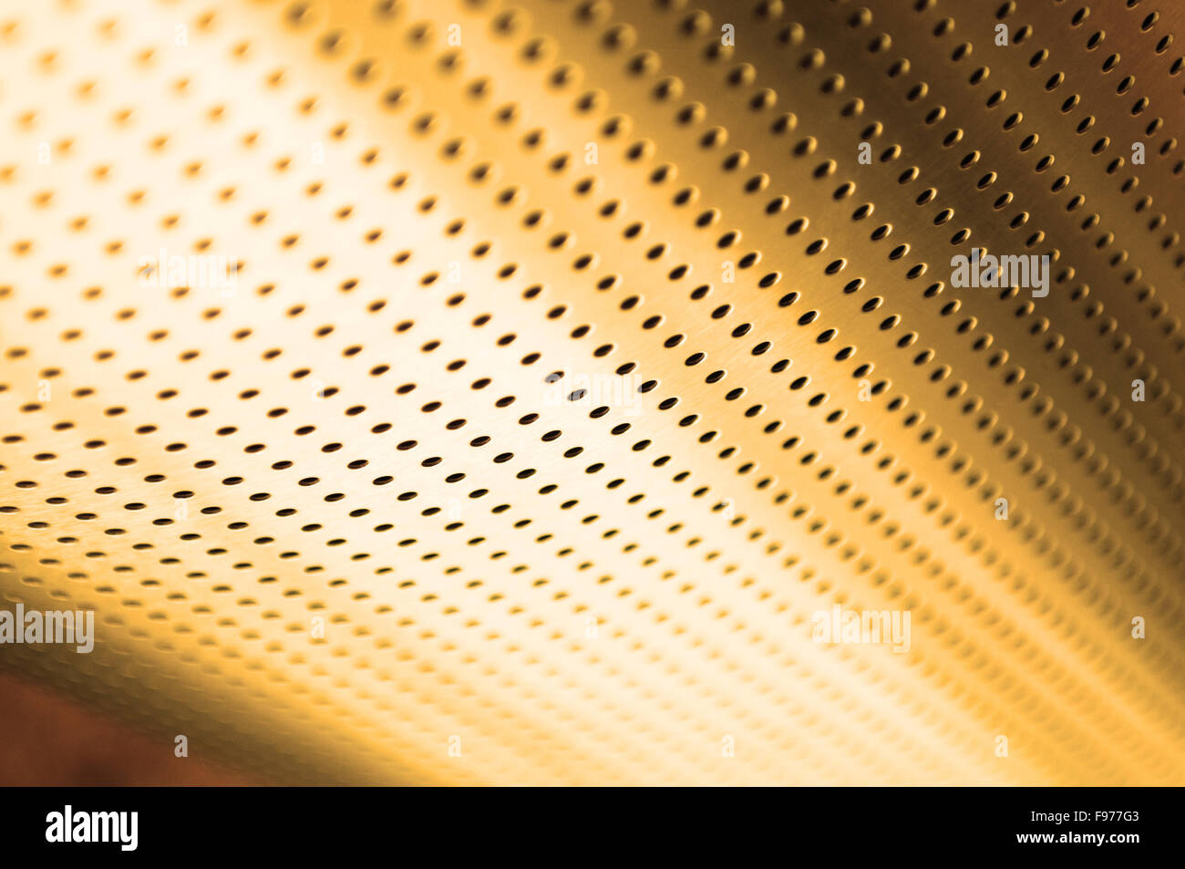 Polished metal surface with the small holes Stock Photo - Alamy
