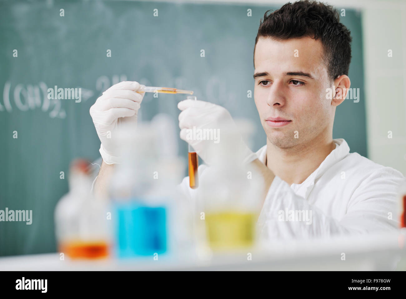 young man scientist in chemistry bright lab Stock Photo - Alamy