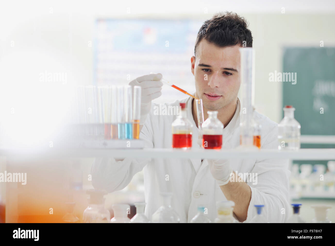 young man scientist in chemistry bright lab Stock Photo - Alamy