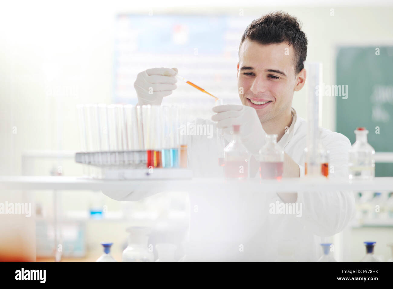 young man scientist in chemistry bright lab Stock Photo - Alamy