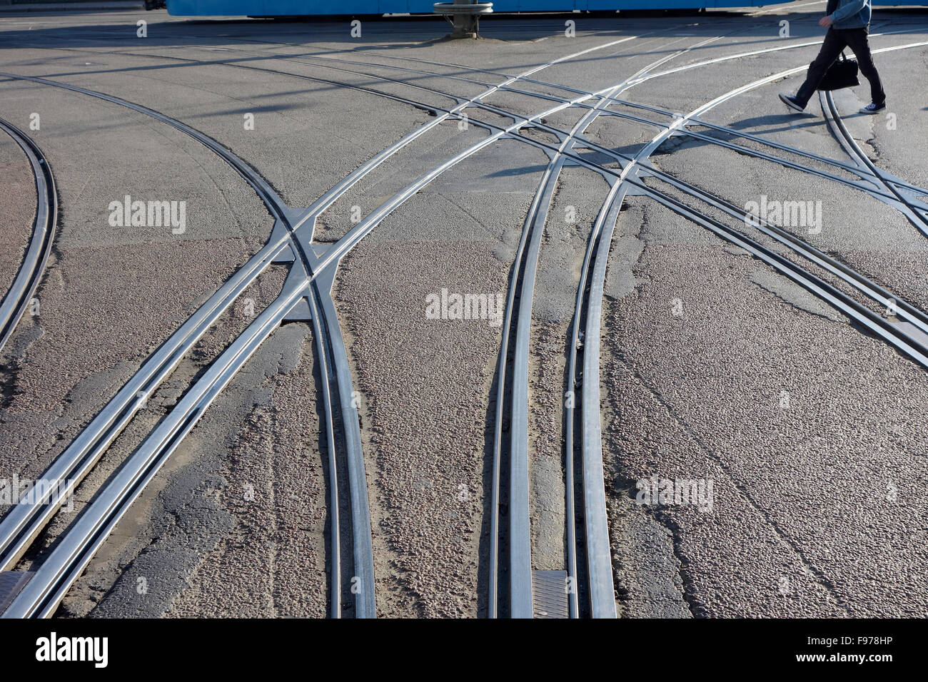 Tramway Tracks and a pedestrian Stock Photo - Alamy