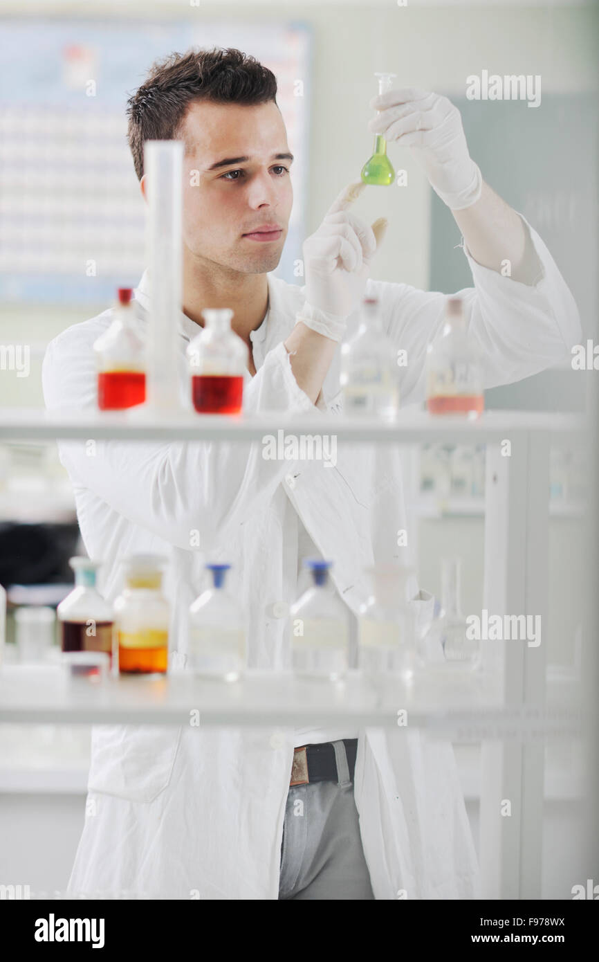 young man scientist in chemistry bright lab Stock Photo - Alamy