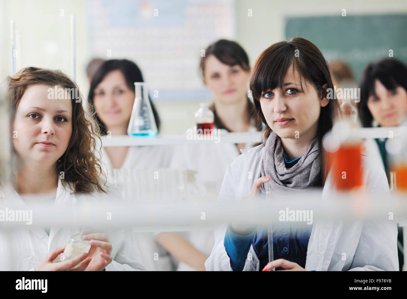 young woman students group in bright chemistry lab Stock Photo - Alamy