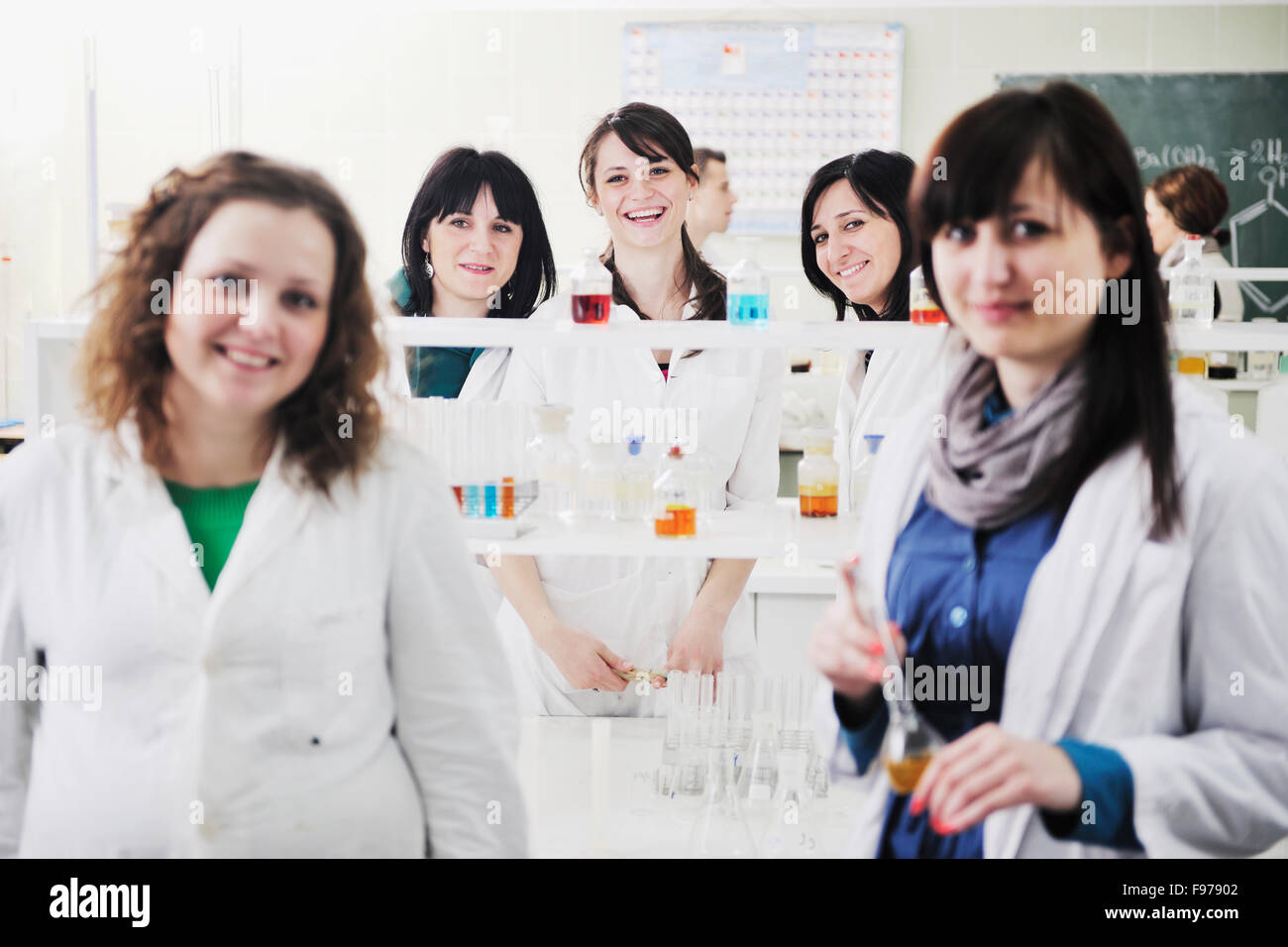 young woman students group in bright chemistry lab Stock Photo - Alamy