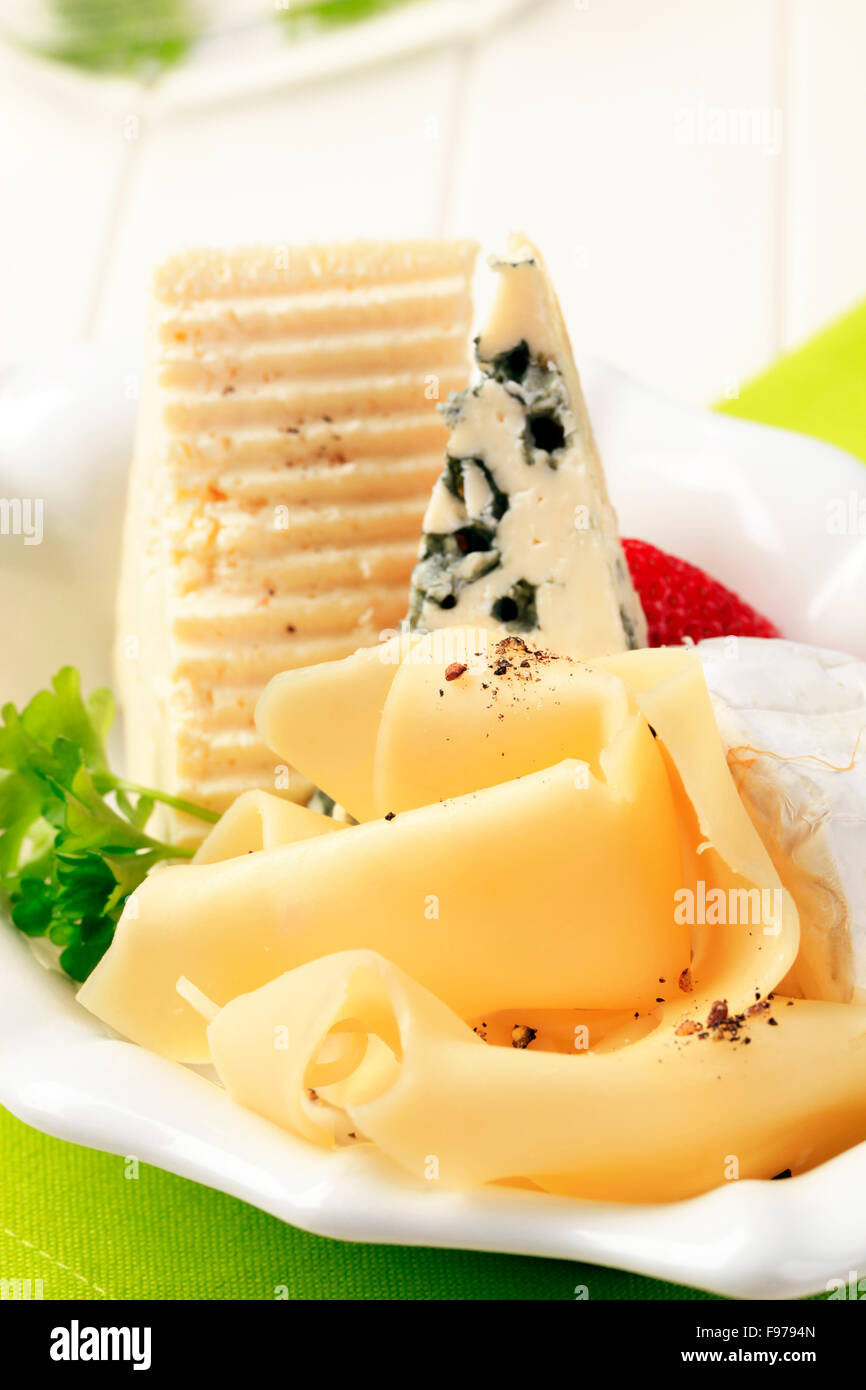 Assorted cheeses in a bowl Stock Photo - Alamy