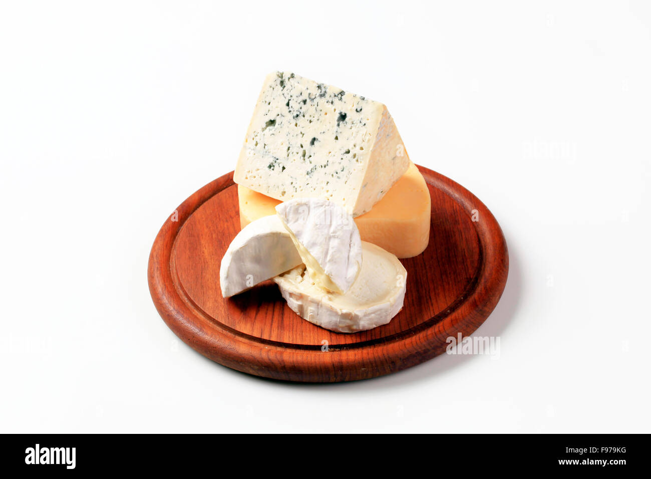 Selection of cheeses on a cutting board Stock Photo - Alamy