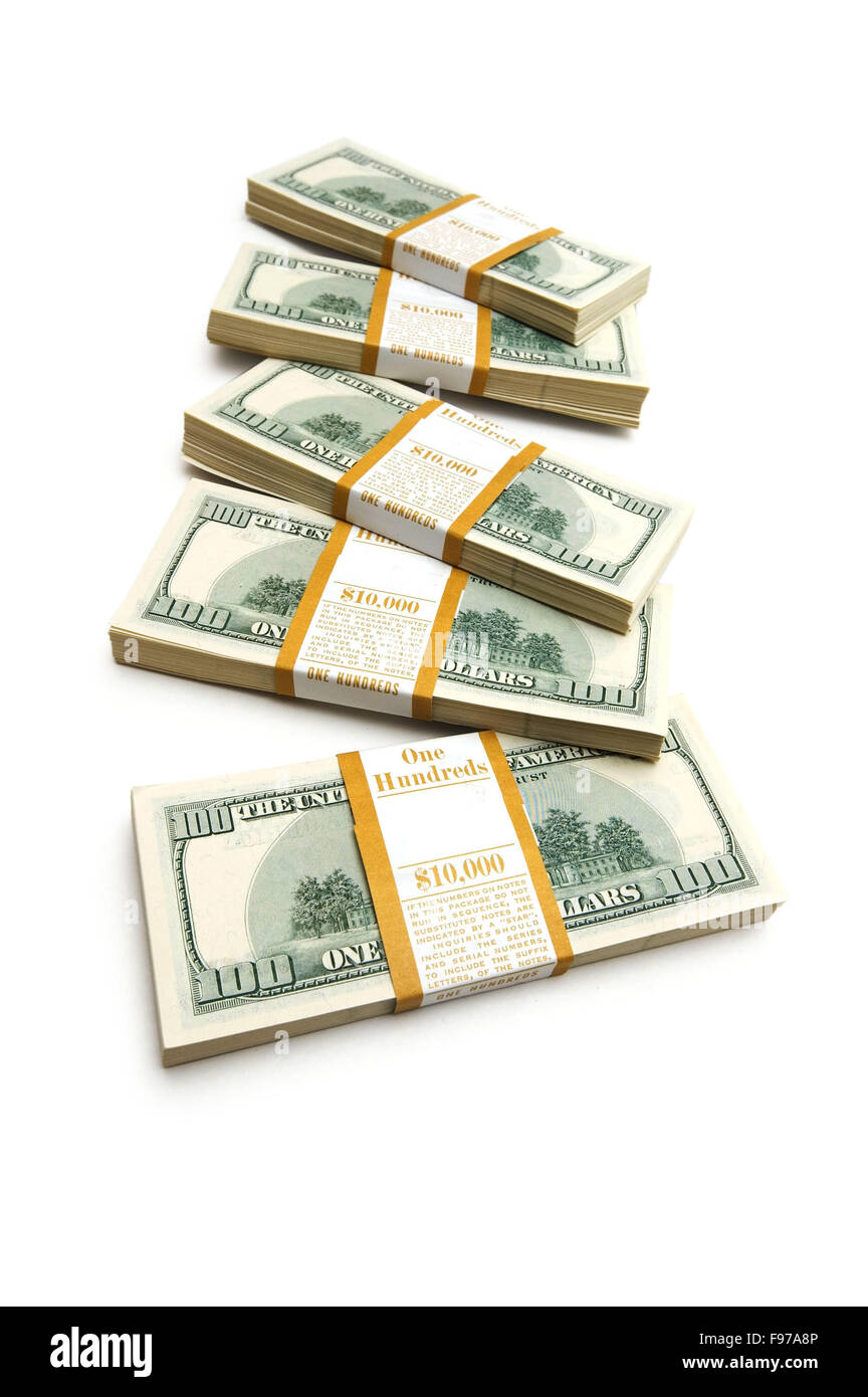 Ten thousand dollar stacks on the white Stock Photo - Alamy