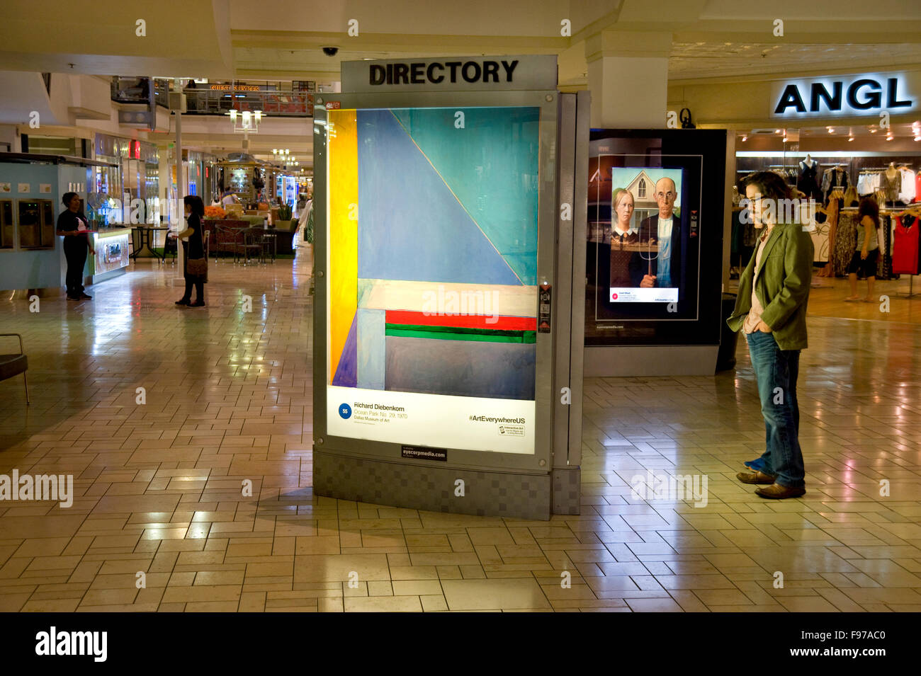 Fine Art images appear on digital advertising kiosks in a shopping mall ...