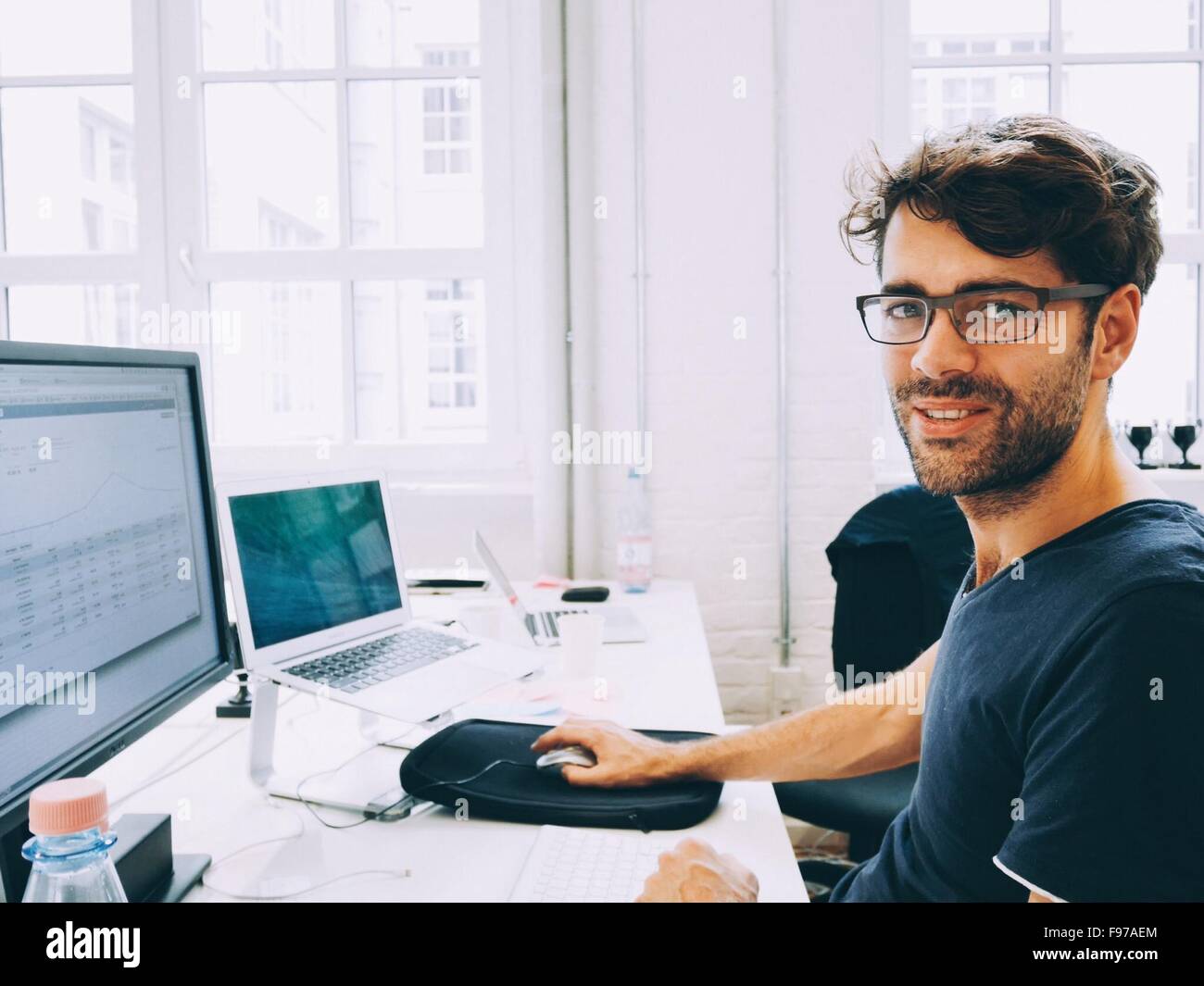 Person on computer in office hi-res stock photography and images - Alamy