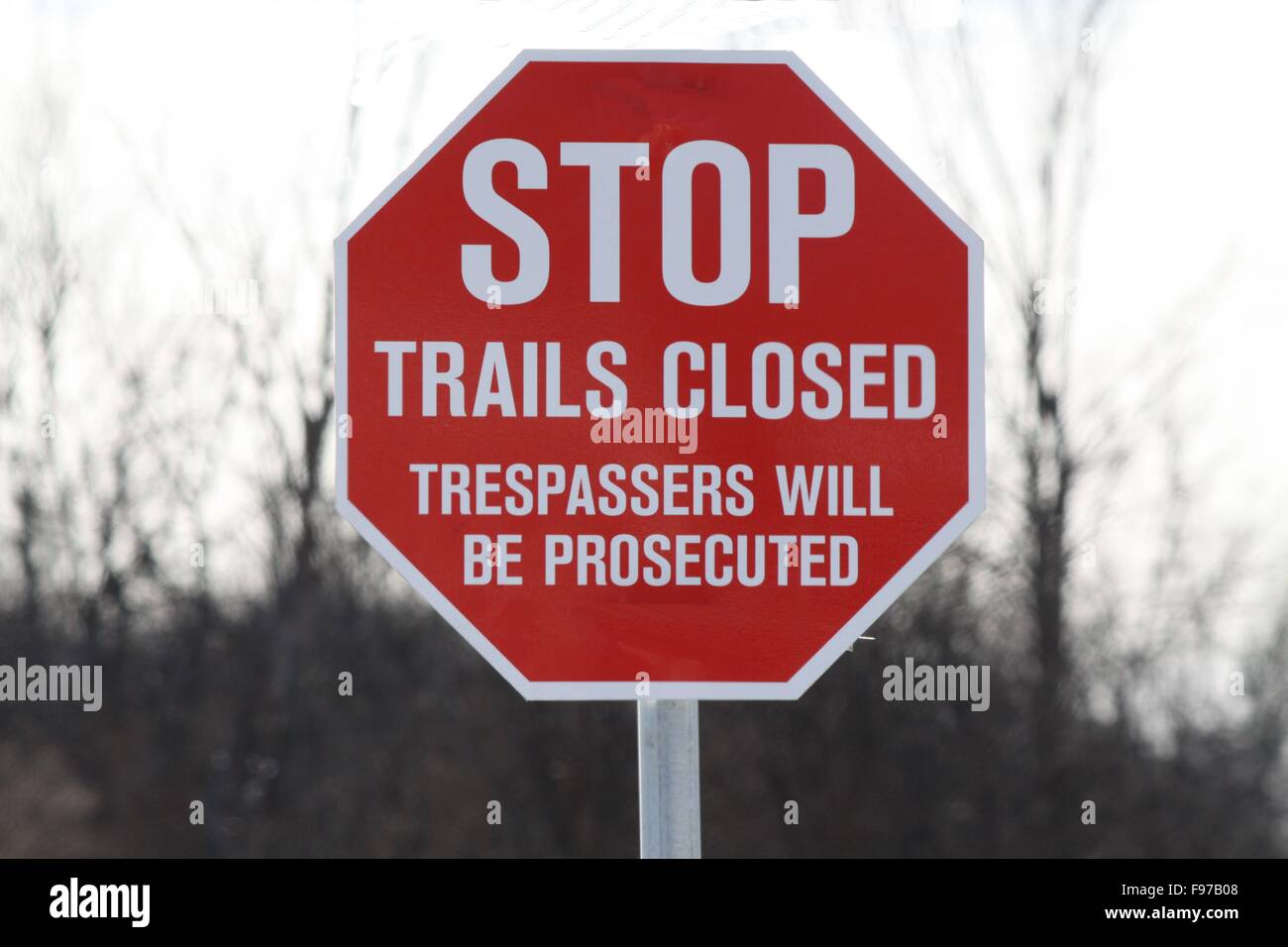 Stop-Sign, Red with white lettering on a metal post, warning of trails ...