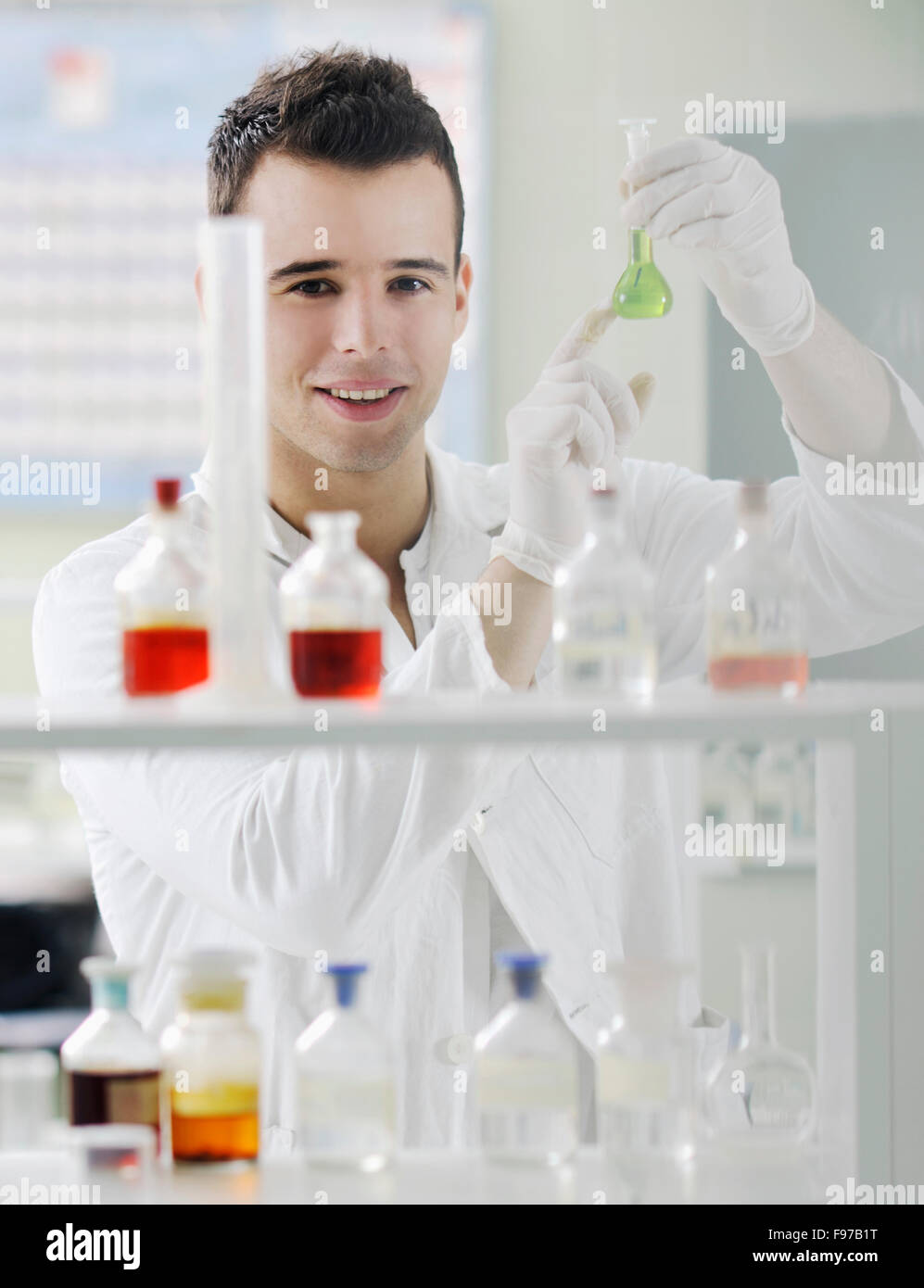 young man scientist in chemistry bright lab Stock Photo - Alamy