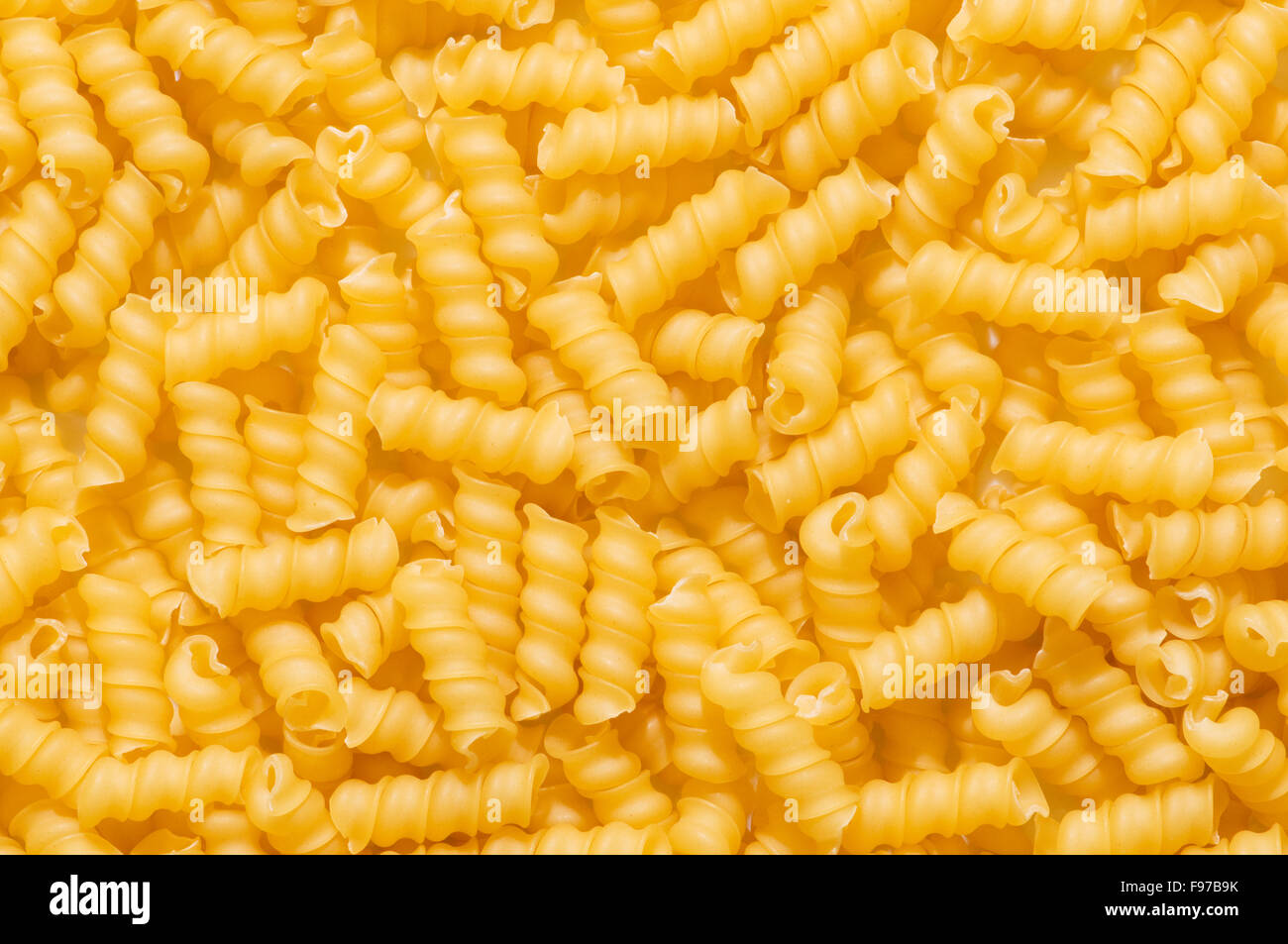 Close up of italian pasta - spiral shaped Stock Photo - Alamy