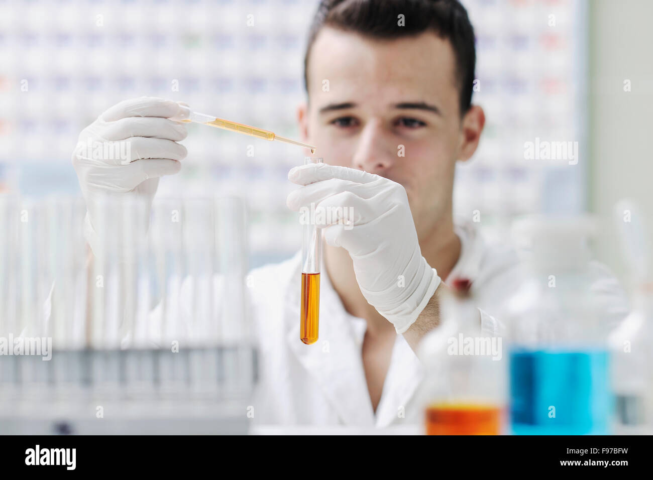 young man scientist in chemistry bright lab Stock Photo - Alamy