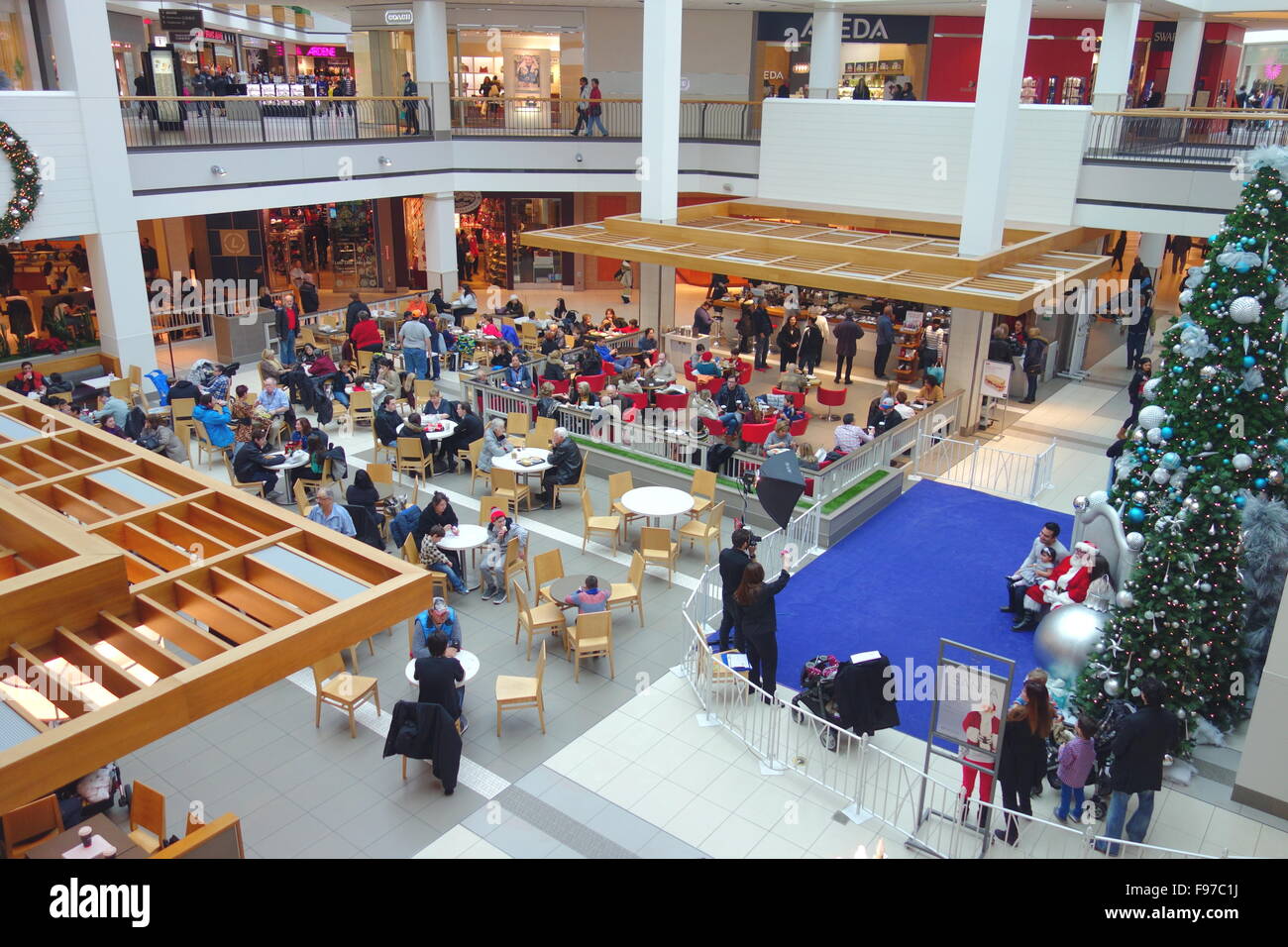 People sitting at tables at a mall food court in Toronto, Canada Stock ...