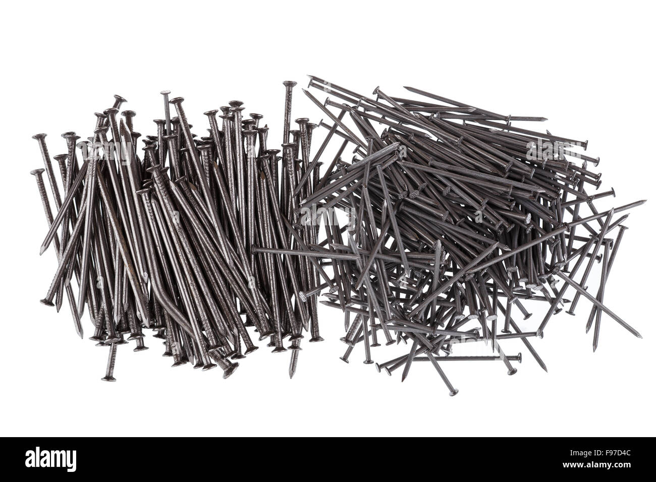 Pile of nails on a white background Stock Photo - Alamy