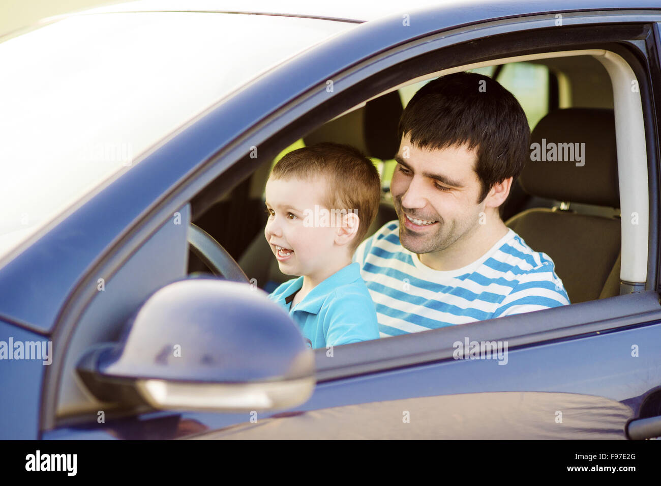Young father with his little son driving car together Stock Photo - Alamy