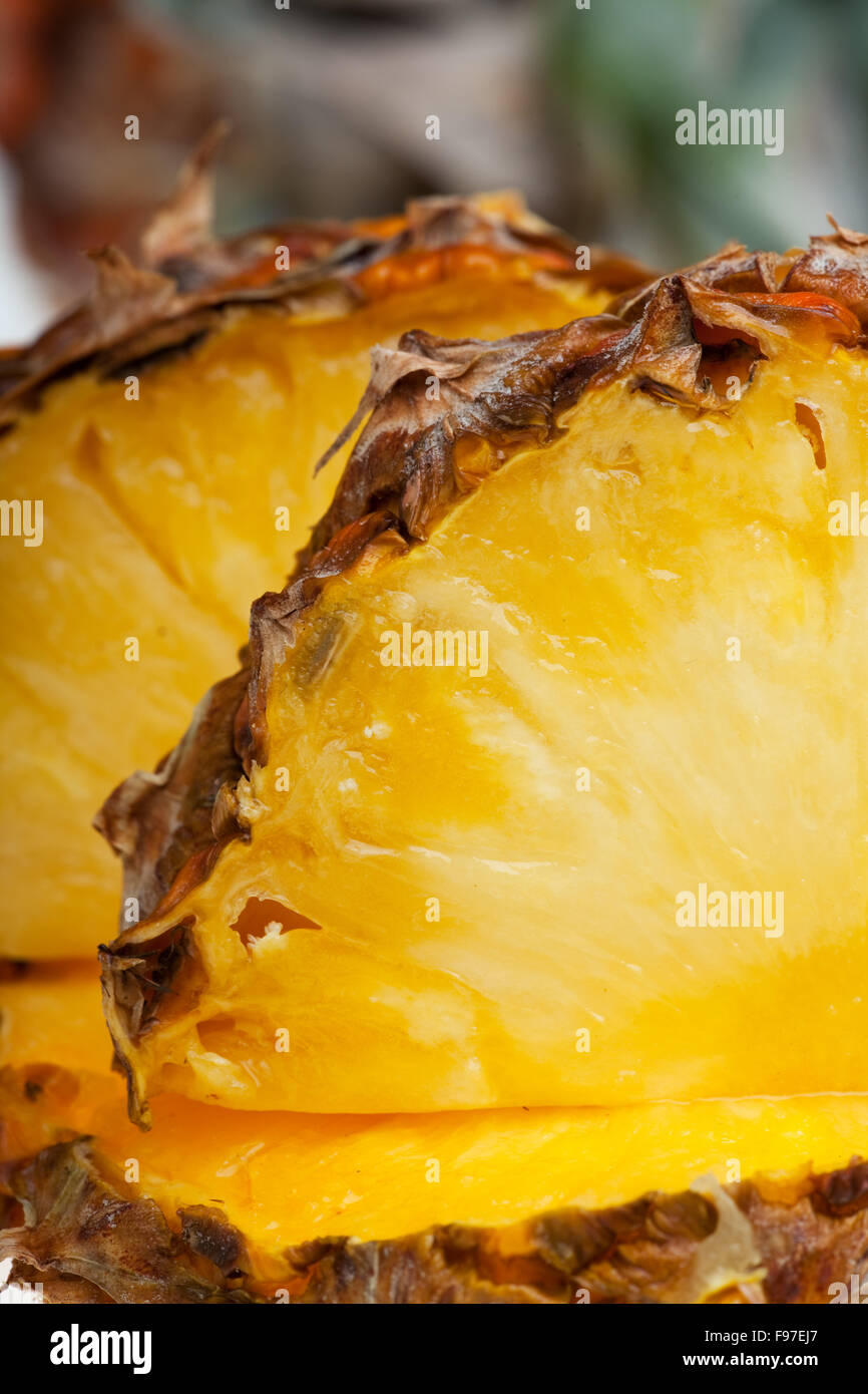 slices of a ripe pineapple isolated on white background Stock Photo - Alamy