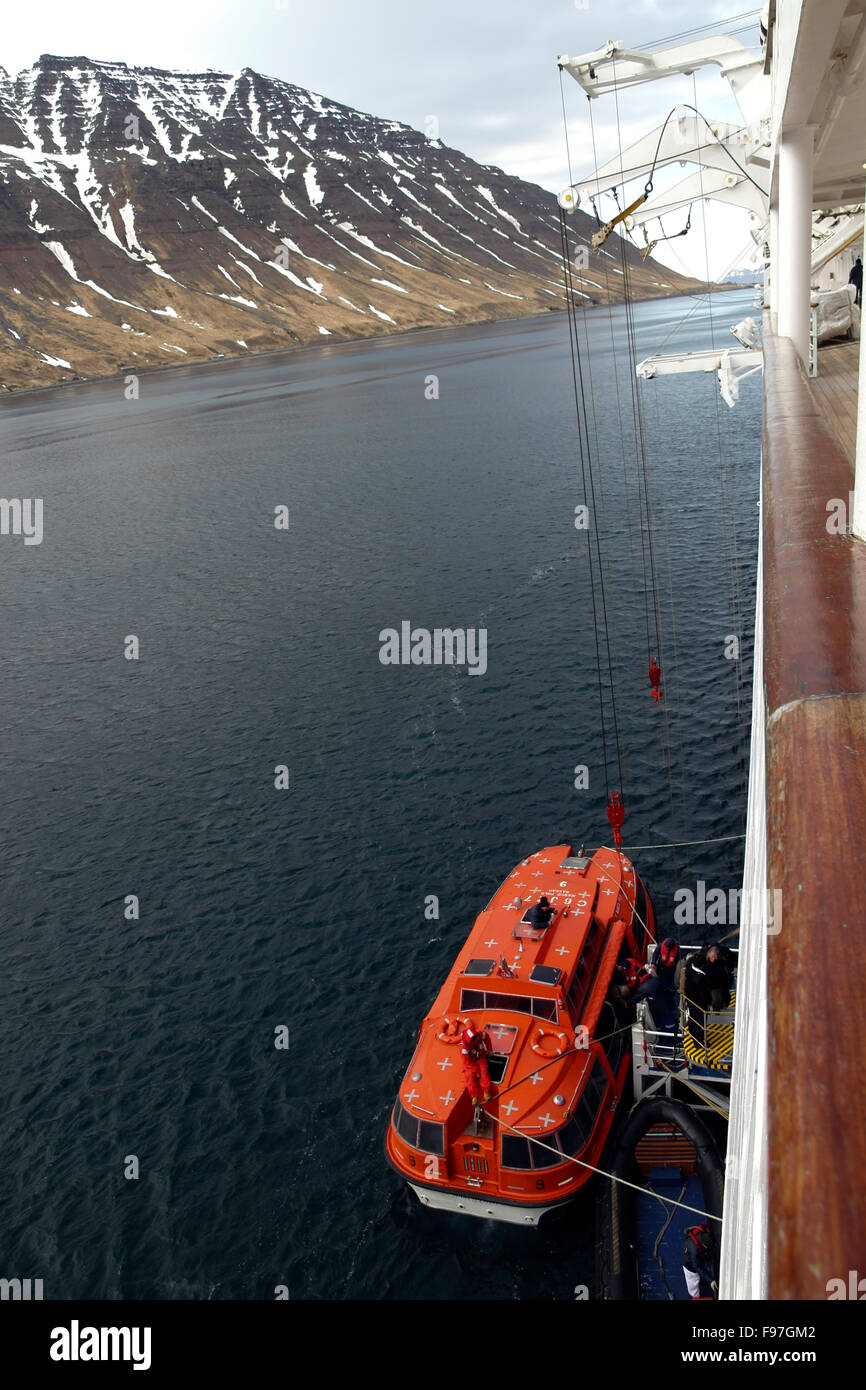 Passengers on a cruise ship disembark on a tender, Isafjörður Harbour ...