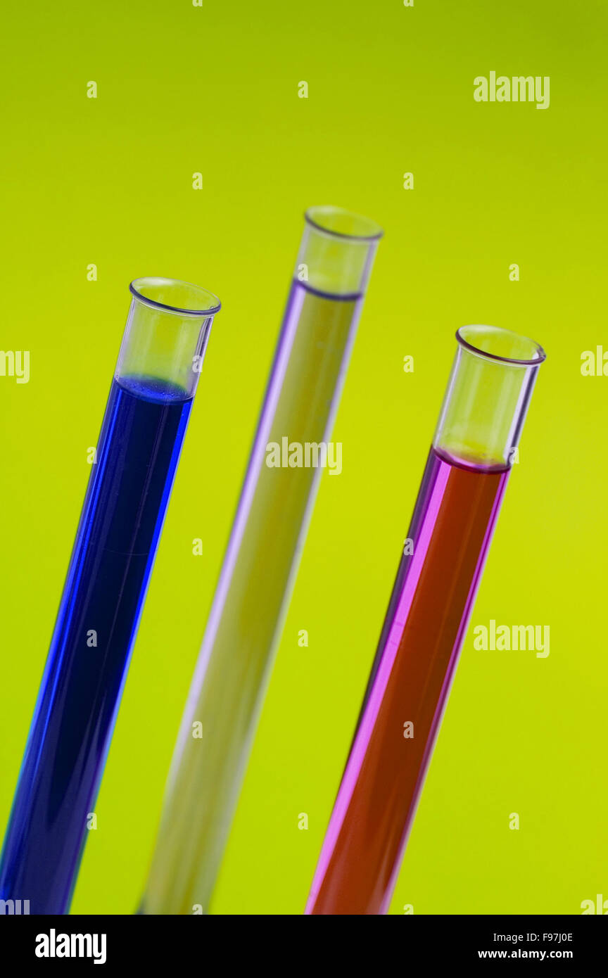 Three retorts in the lab against yellow background Stock Photo - Alamy