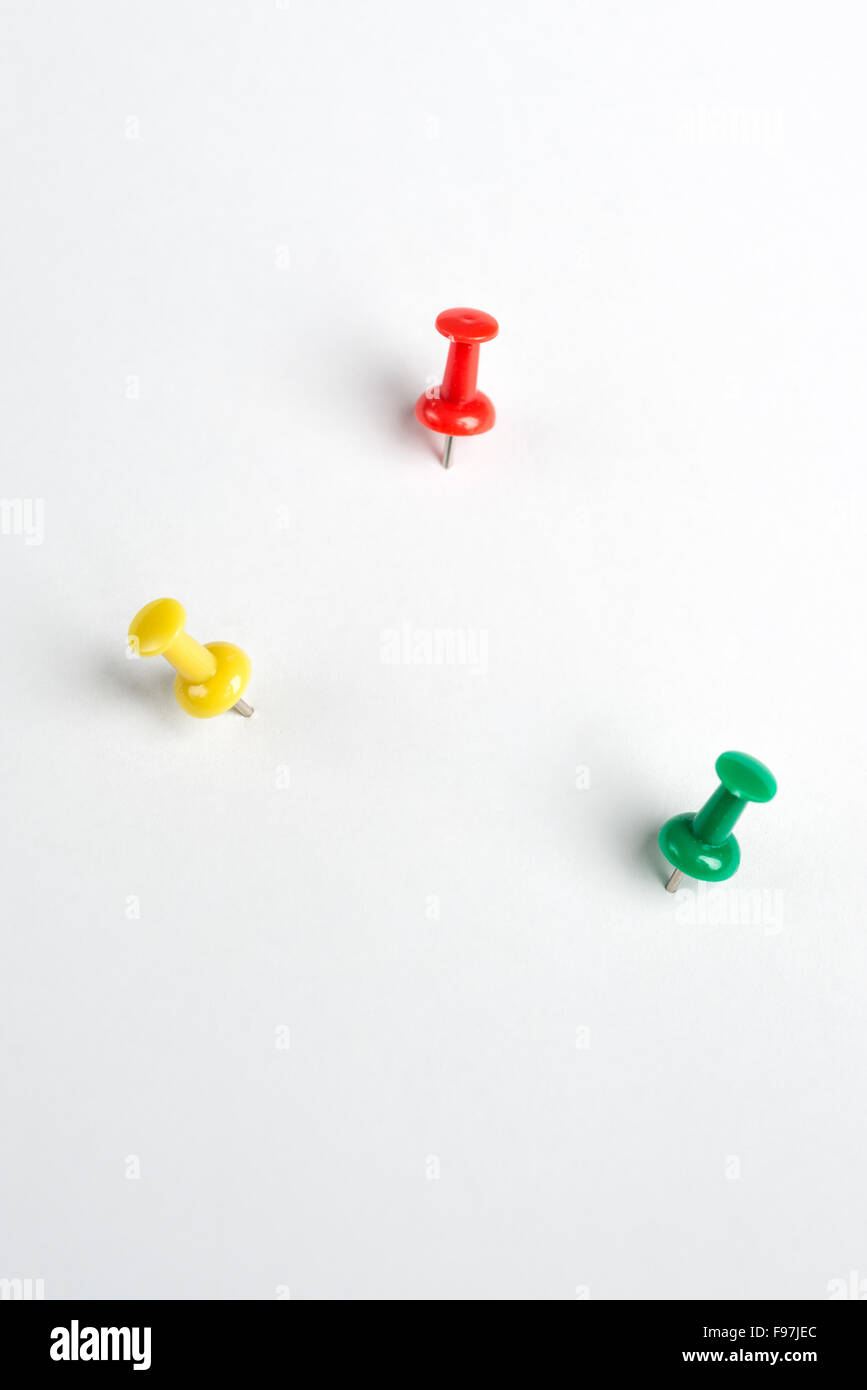 3 pins on a white background Stock Photo - Alamy